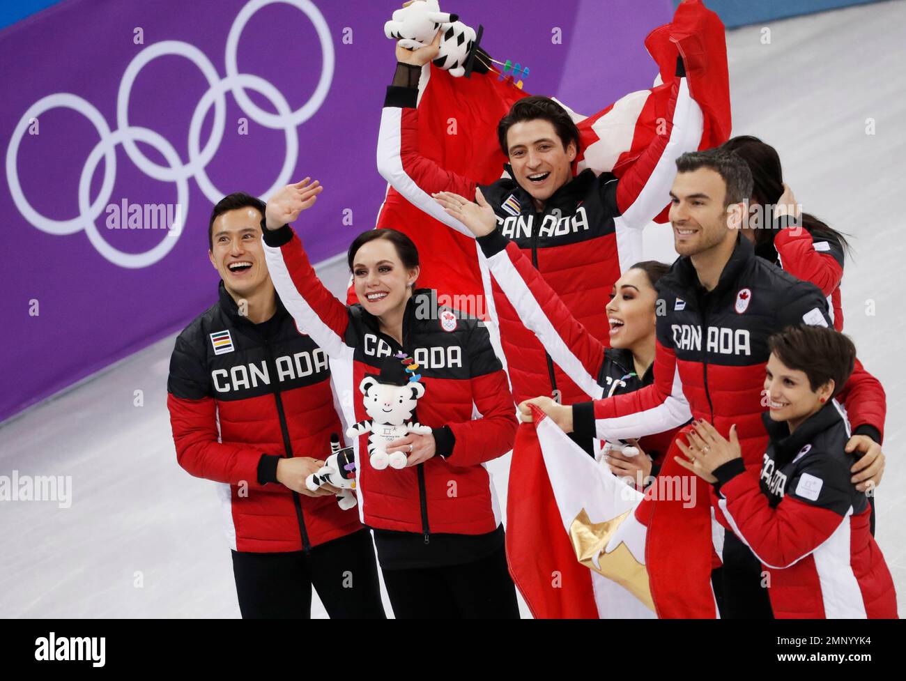The Canadian team celebrate on the ice following the Venue Ceremony ...