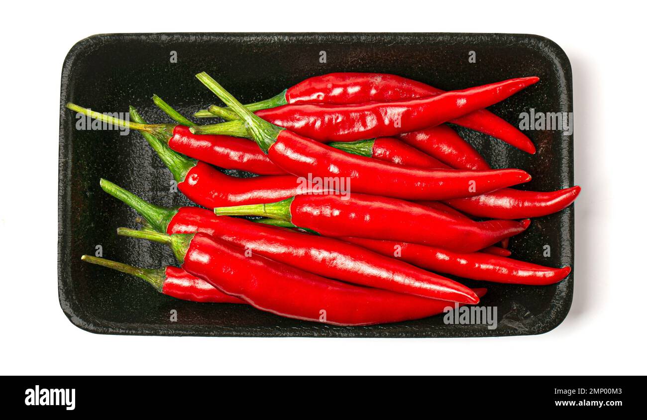 Fresh Red chili pepper in a black disposable plastic packing box ...