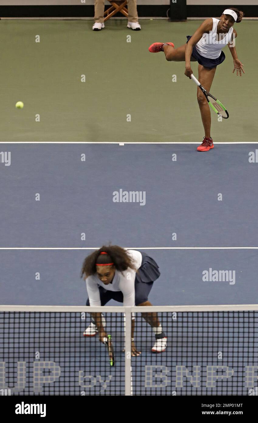 USA's Venus Williams serves over sister Serena Williams in their ...