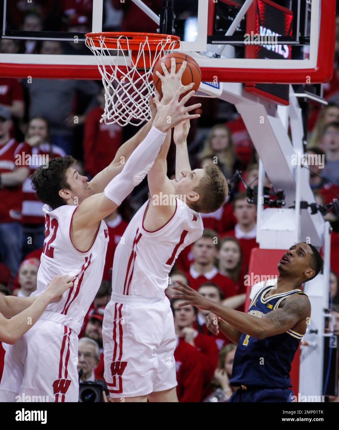 Wisconsin's Ethan Happ, left, and Brevin Pritzl go after a rebound ...