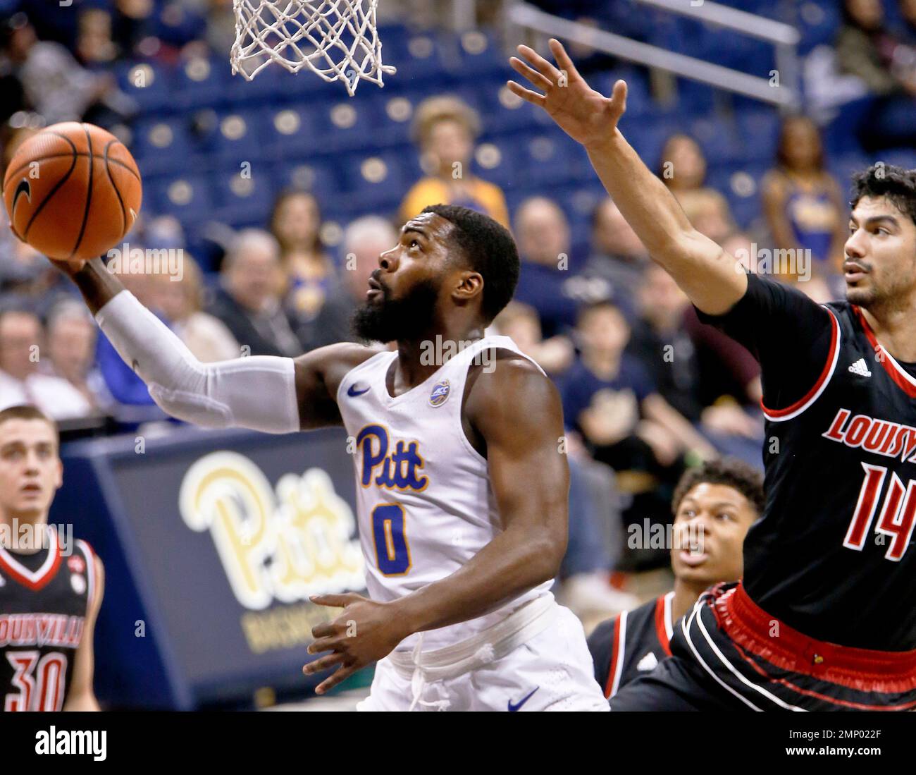 Pittsburgh's Jared Wilson-Frame (0) shoots as Louisville's Anas Mahmoud ...