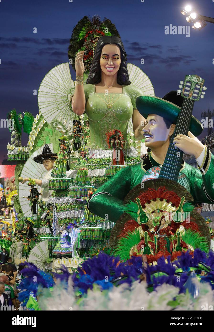 Dancers from the Vila Maria samba school perform on a float during a ...