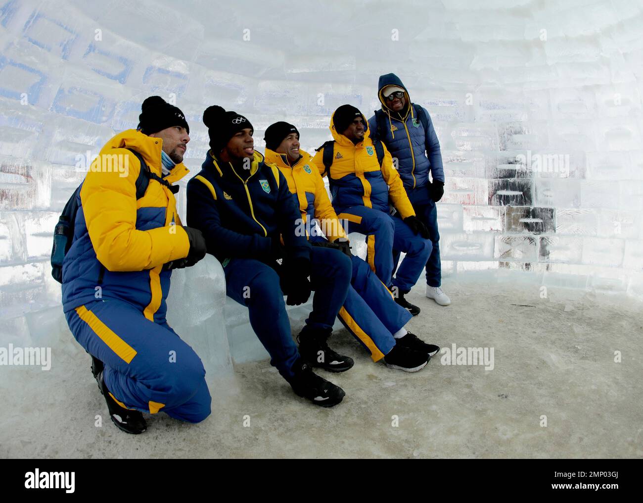 Members of the Brazilian bobsled team pose for a photo inside an igloo ...