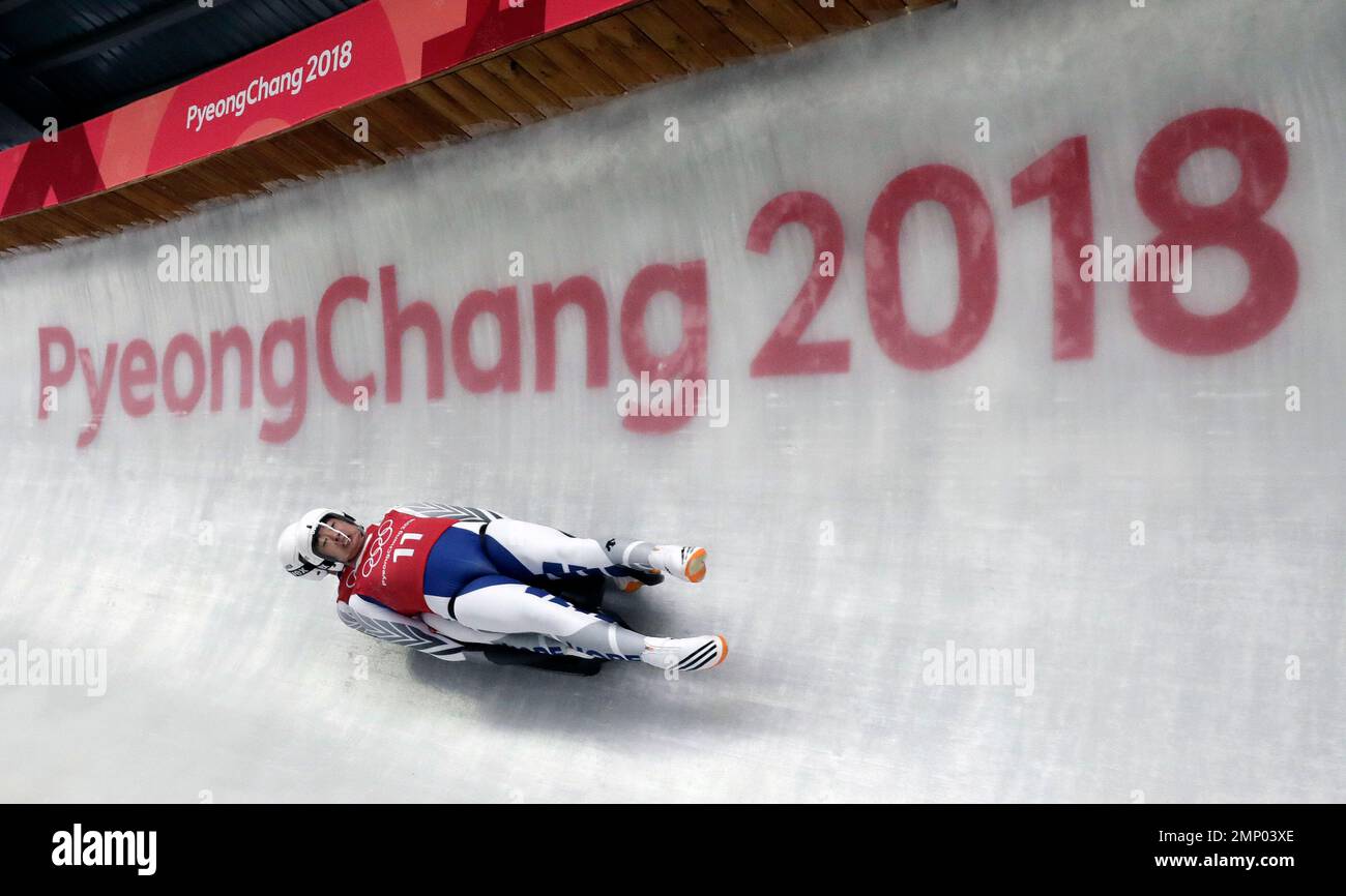 Park Jinyong and Cho Jung Myung of Korea slide down the track during a ...