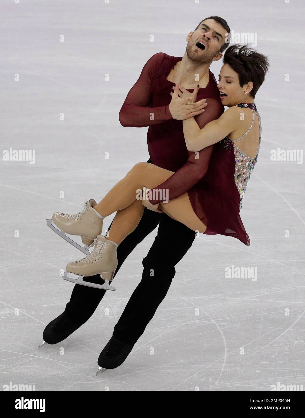 Meagan Duhamel and Eric Radford of Canada perform in the team event ...