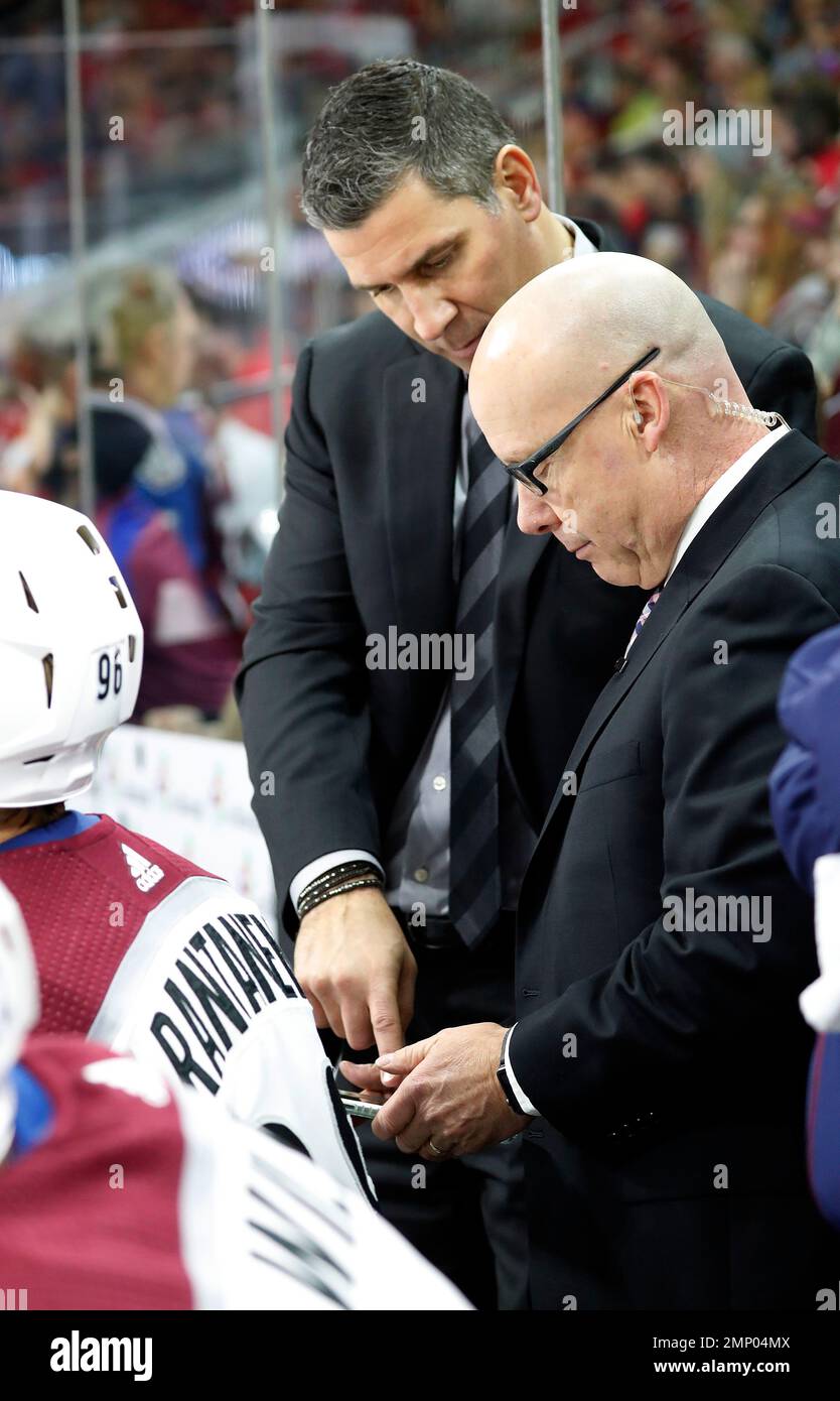 Colorado Avalanche head coach Jared Bednar, left, speaks with assistant ...