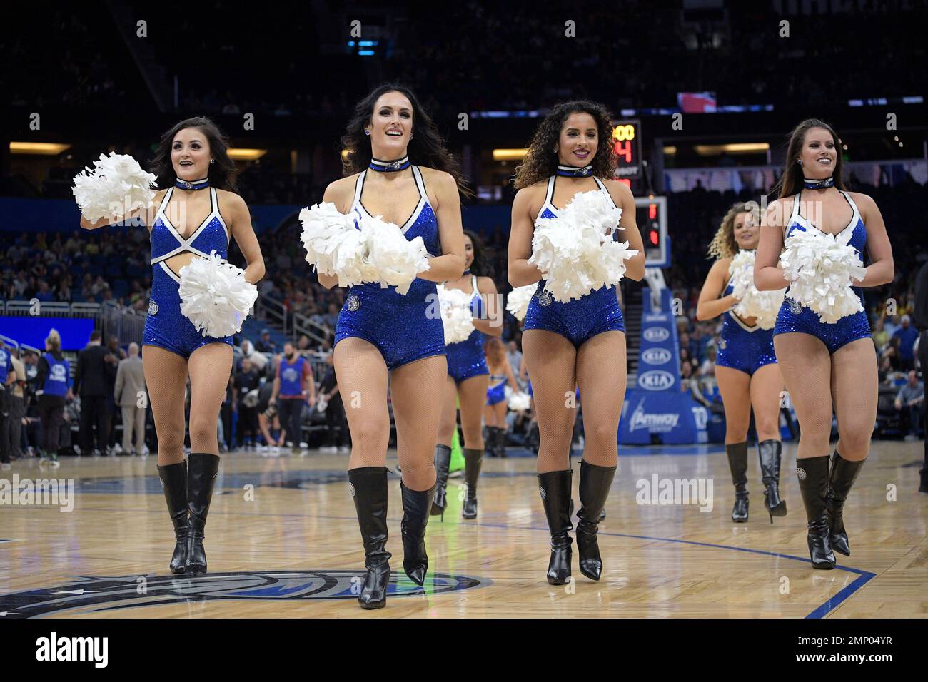 The Orlando Magic dancers jog off the court after performing during the ...