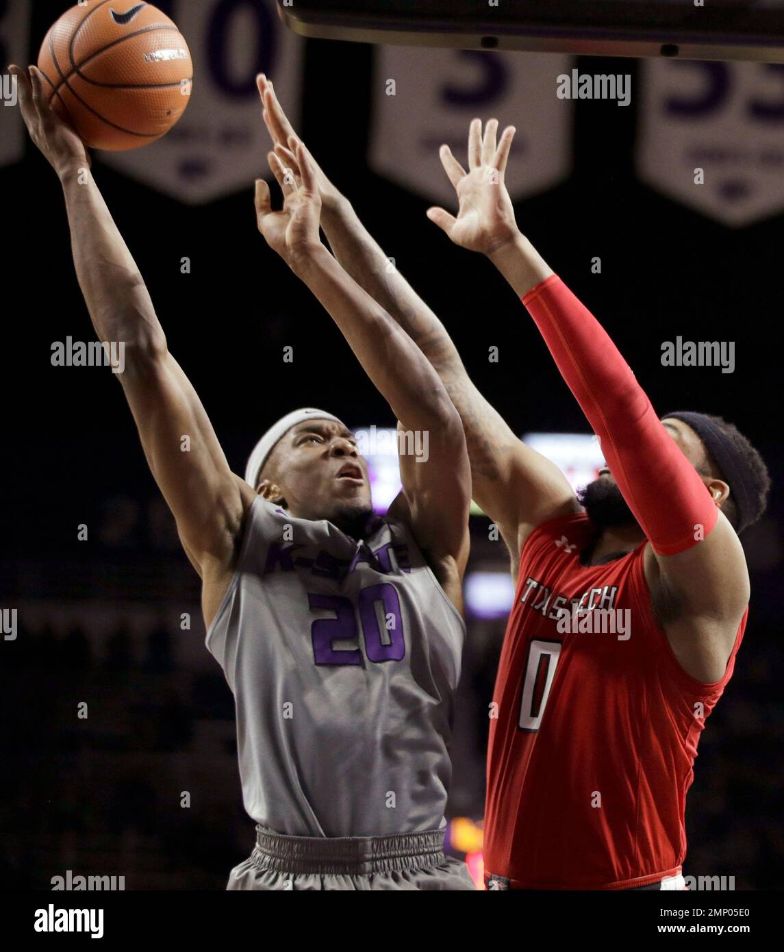 Kansas State forward Xavier Sneed (20) shoots over Texas Tech forward ...
