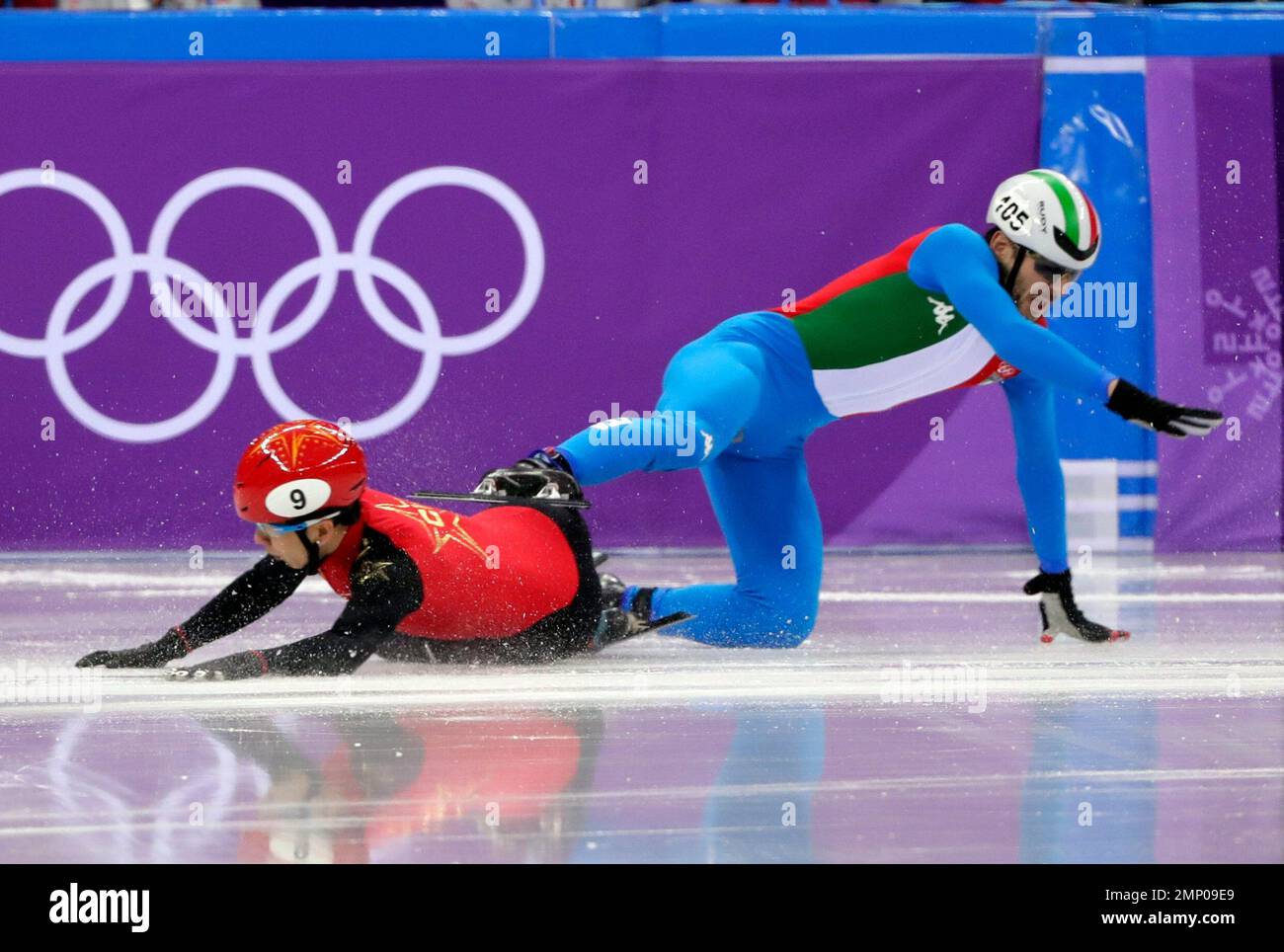 Tianyu Han of China, left and Yuri Confortola of Italy collide and crash out during the men's ...