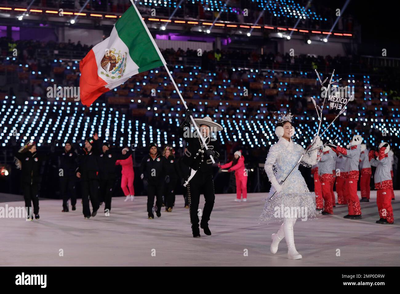 German Madrazo carries the flag of Mexico during the opening ceremony ...