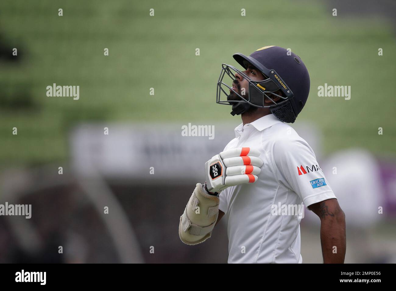 Sri Lanka's Niroshan Dickwell looks skywards to pray as he wakes to the ...