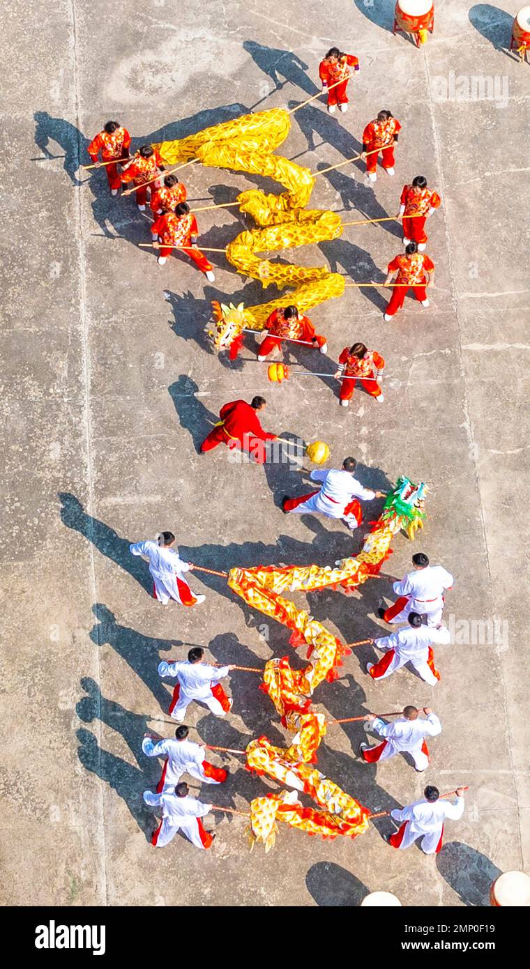 SUQIAN, CHINA - JANUARY 31, 2023 - People perform Dragon and Lion Dance ...