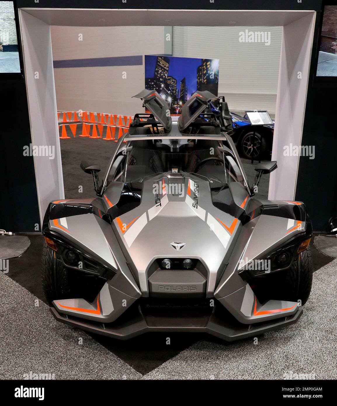 The Polaris Slingshot Grand Touring LE three-wheeled autocycle sits on ...