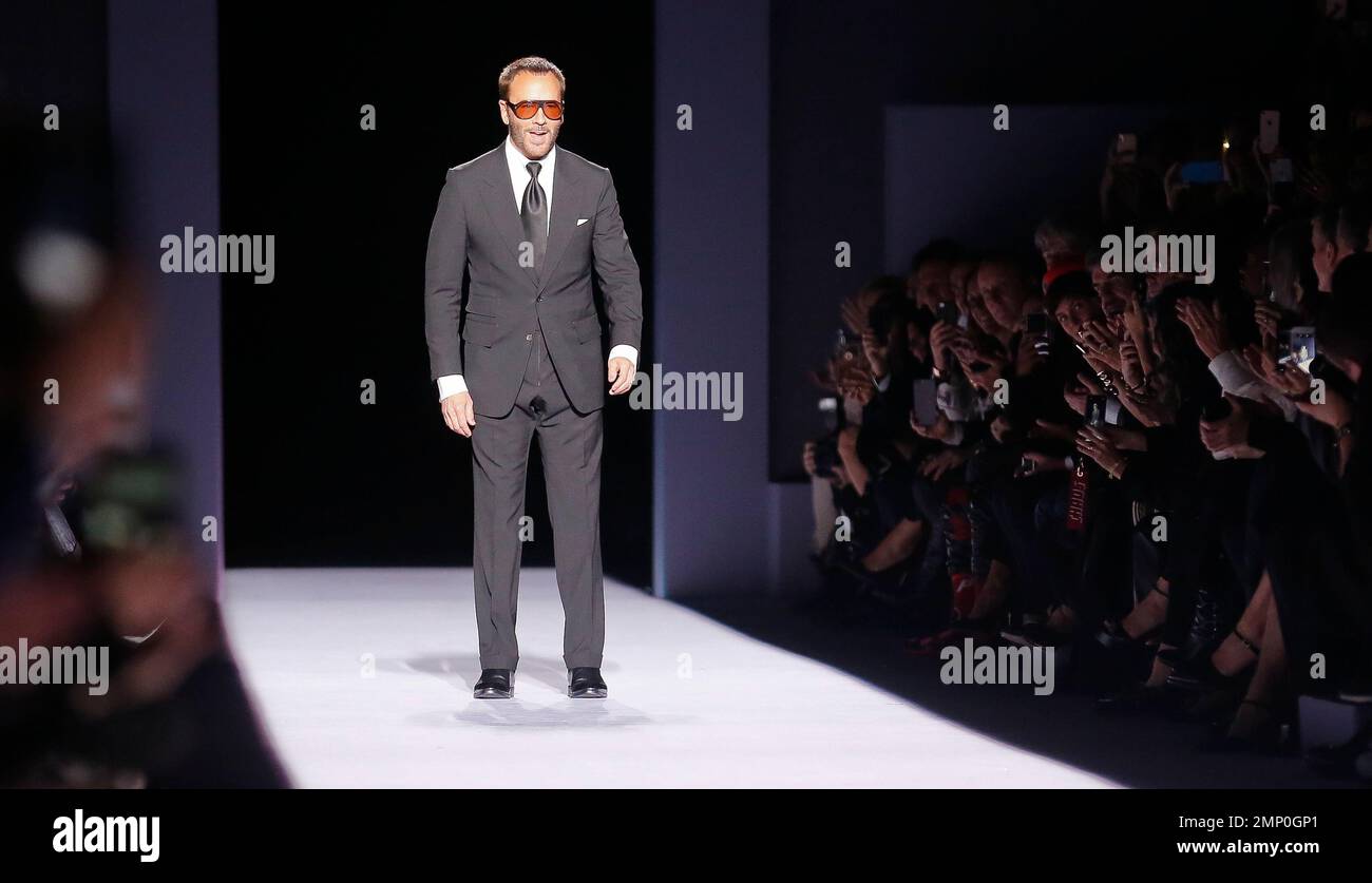 Fashion designer Tom Ford appears on the runway after showing his ...