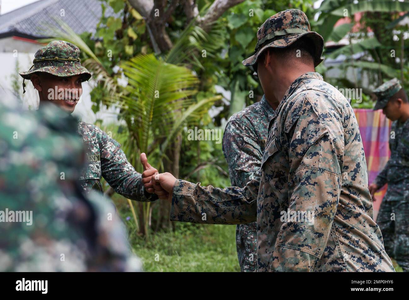 A Philippine Marine Corps scout sniper and force reconnaissance Marine with the 3rd Marine ...