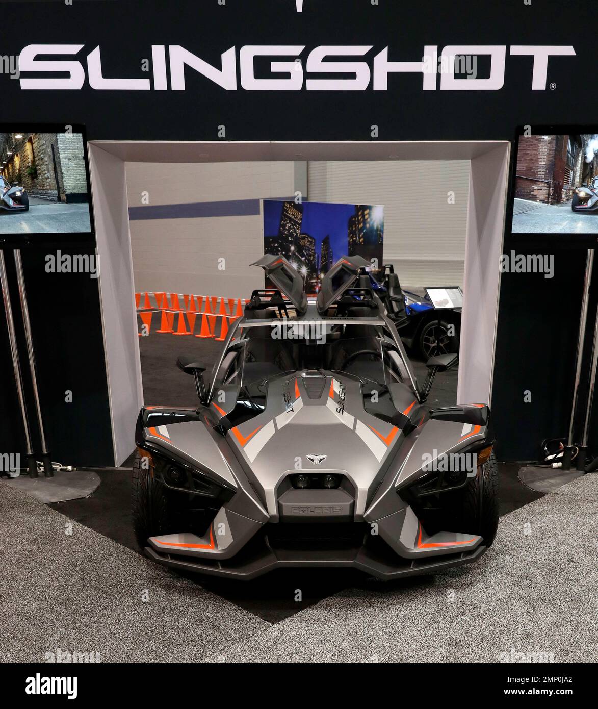 The Polaris Slingshot Grand Touring LE three-wheeled autocycle sits on ...