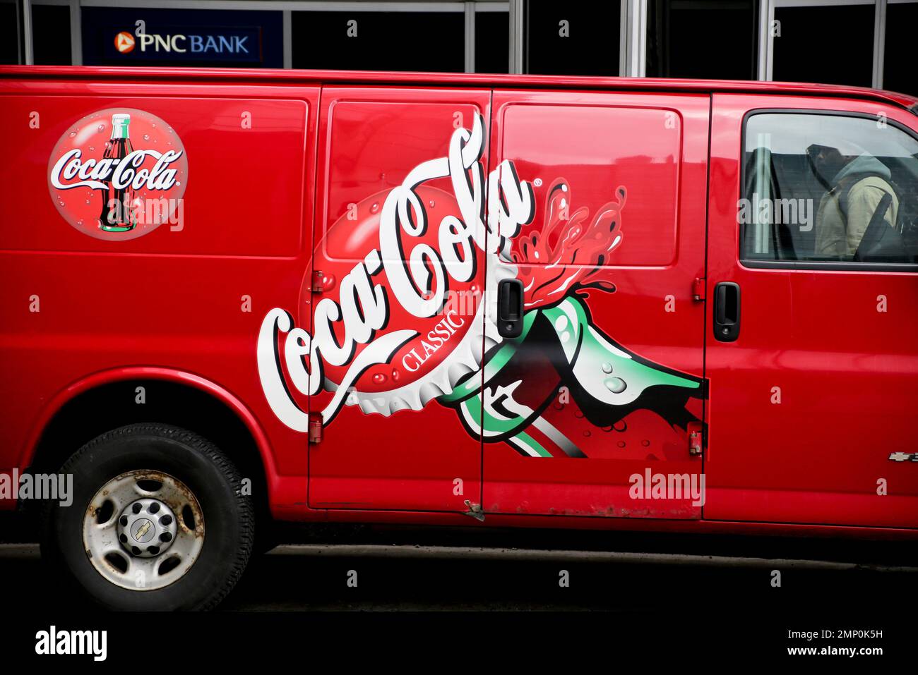 A delivery van is painted with artwork for Classic Coca-Cola in ...