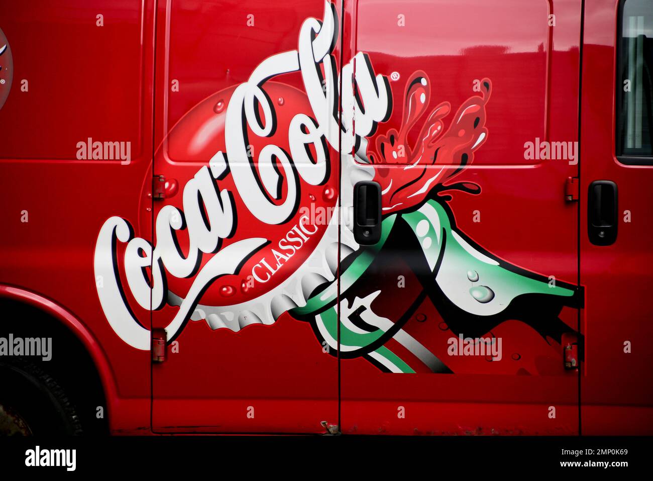 A delivery van is painted with artwork for Classic Coca-Cola in ...