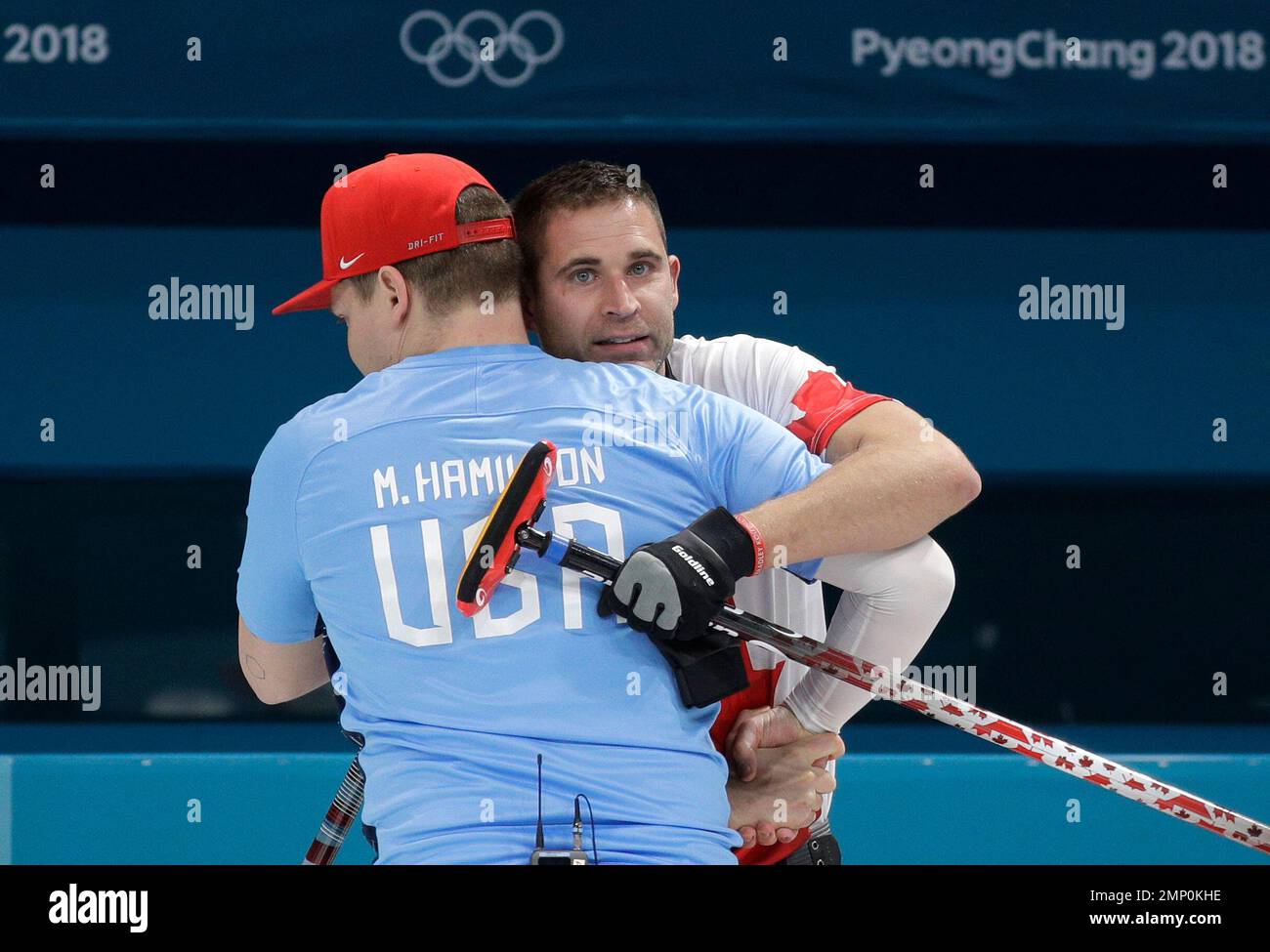 Canada's John Morris, right, embraces United States Matt Hamilton after ...