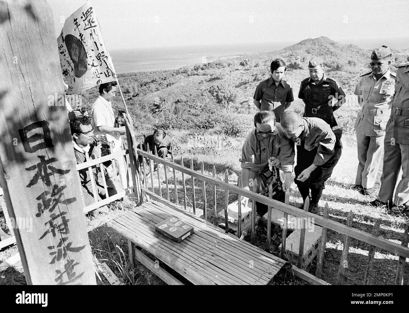 Japanese World War II straggler Hiroo Onoda, right, pays respects at a ...
