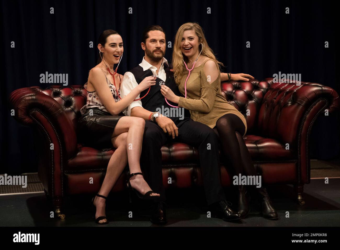 Models pose with the new wax figure of actor Tom Hardy after its ...