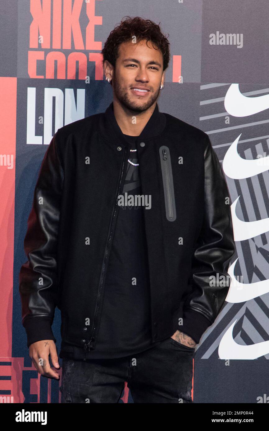 Soccer player Neymar poses for photographers upon arrival at the Nike ...