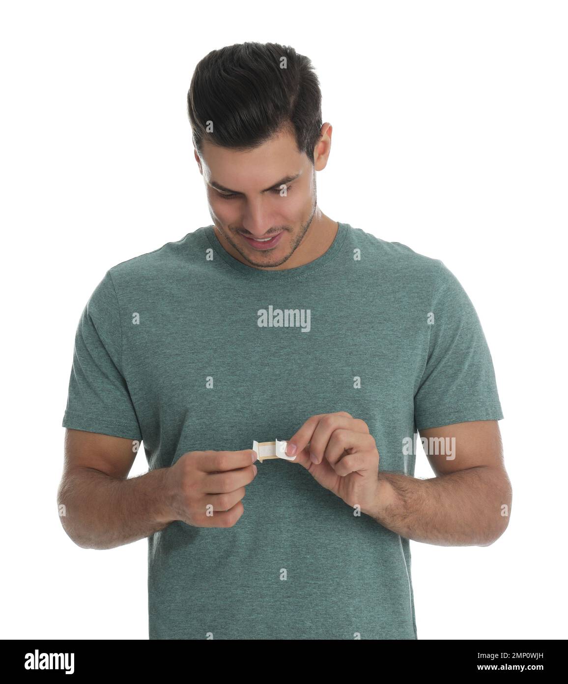 Happy man with sticking plaster on white background Stock Photo - Alamy