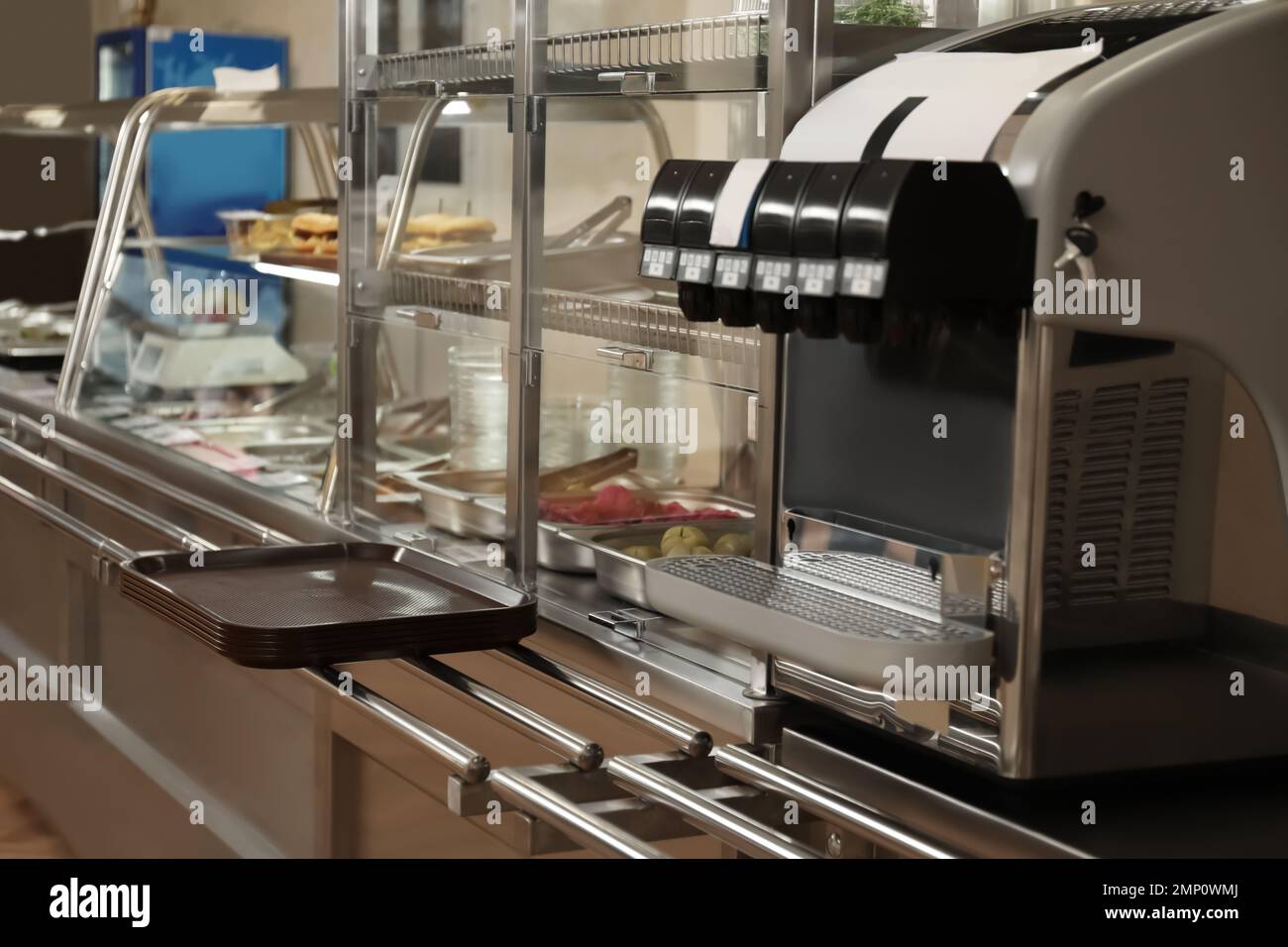 Serving line with tasty food and beverage dispenser in school canteen ...