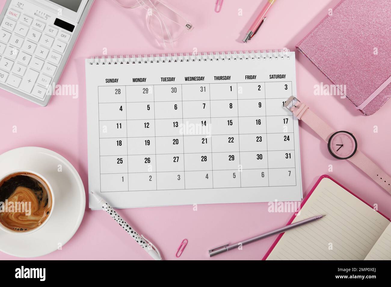 Flat lay composition with calendar on pink background Stock Photo - Alamy