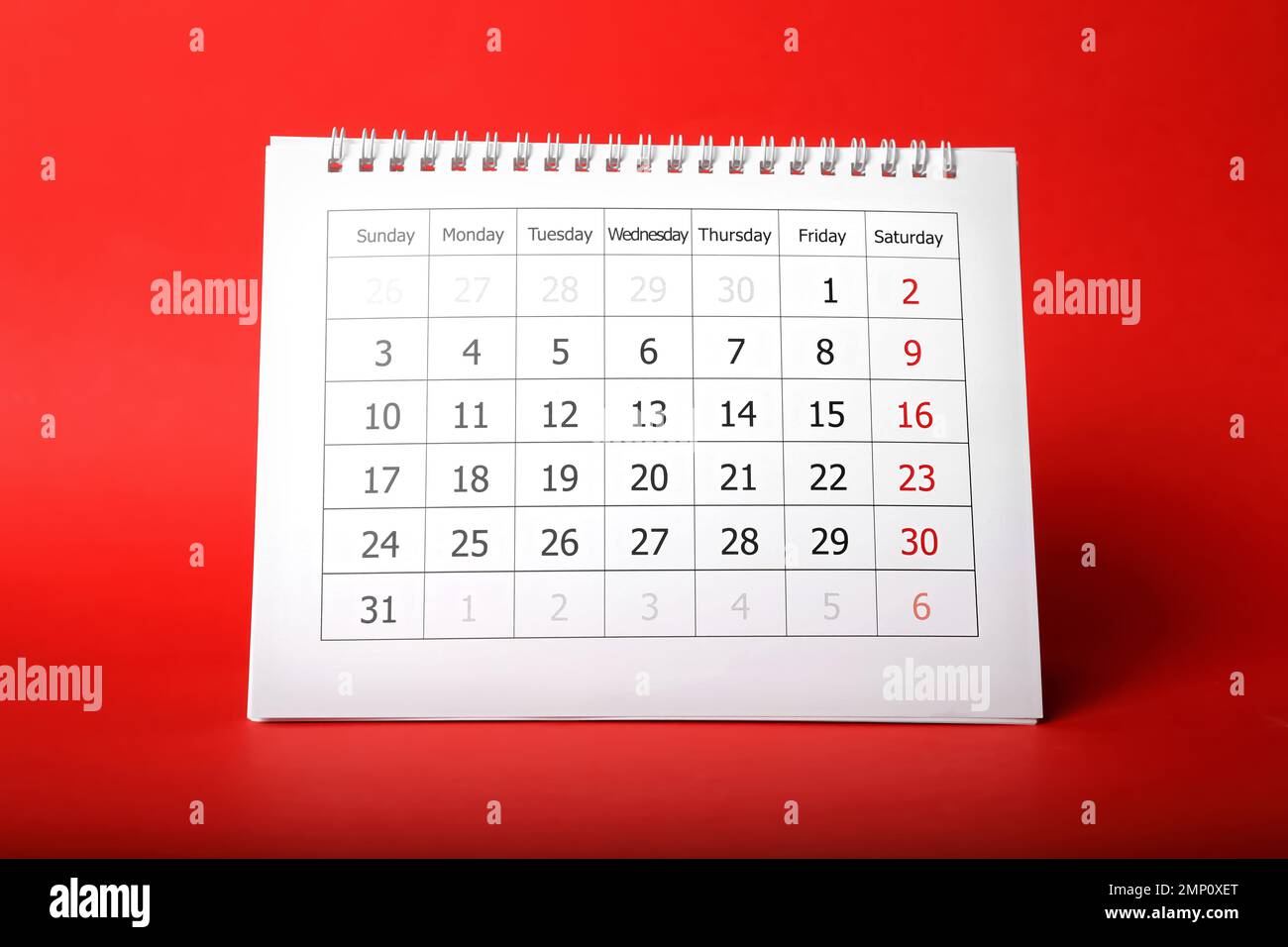 Paper calendar on red background. Planning concept Stock Photo - Alamy