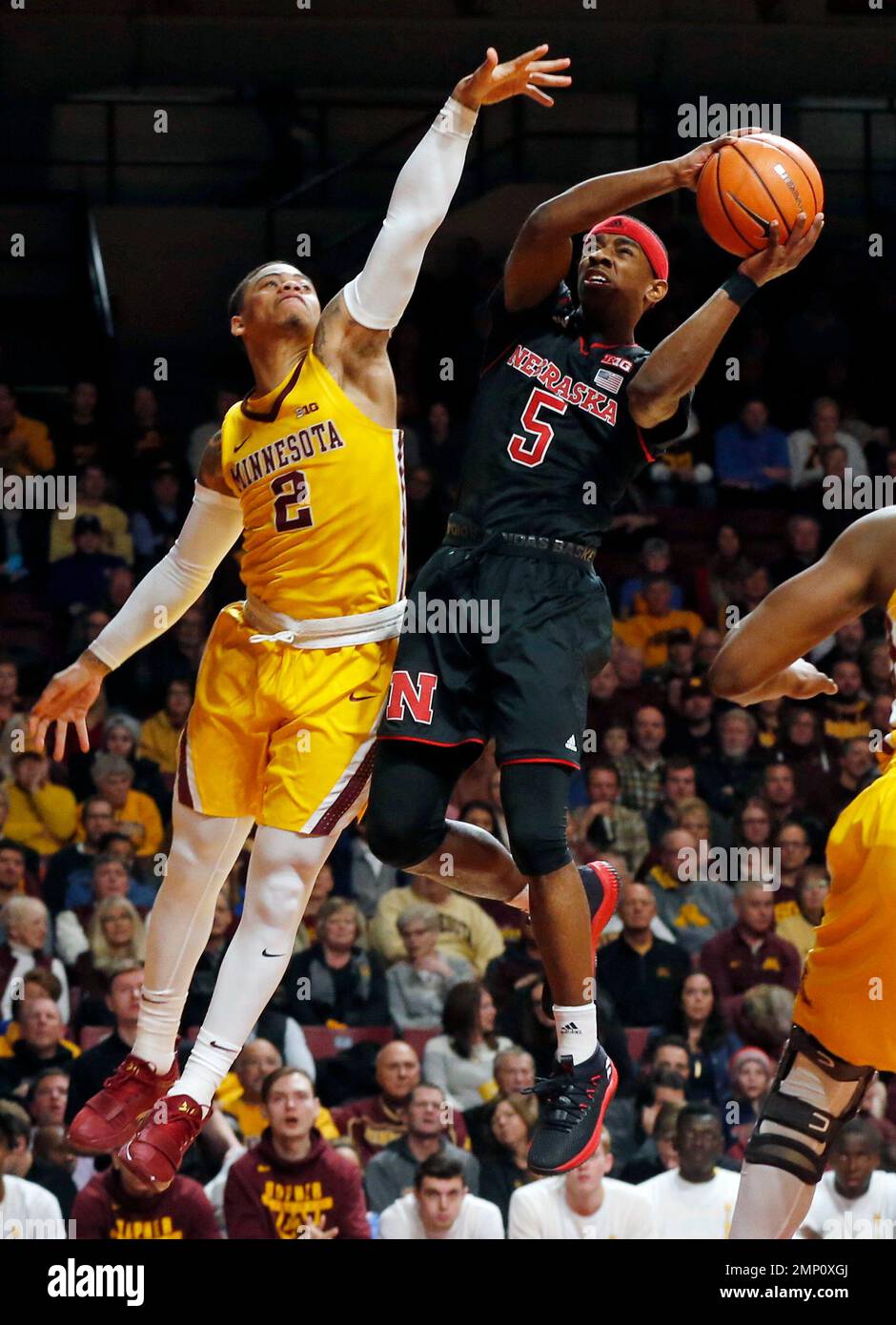 Nebraska's Glynn Watson Jr., right, looks to shoot as Minnesota's Nate ...