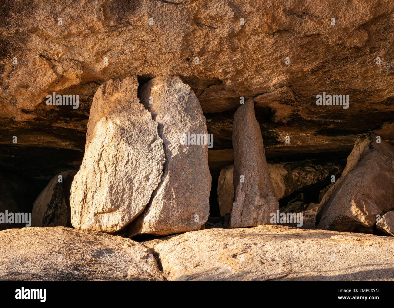 a close up of a rock being crushed under weight Stock Photo - Alamy