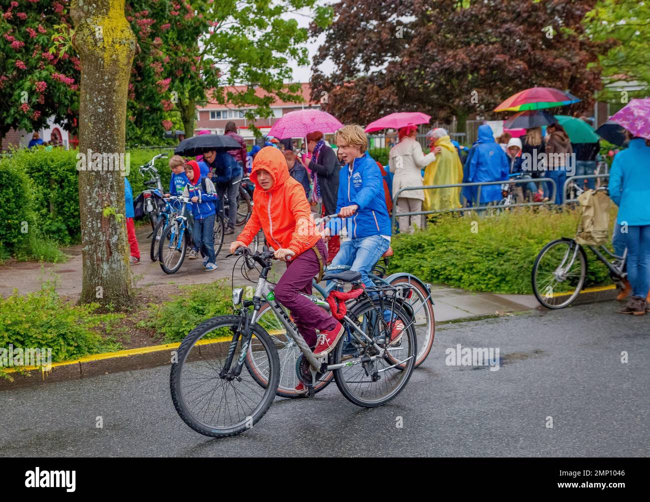 Children bike rain hi-res stock photography and images - Alamy
