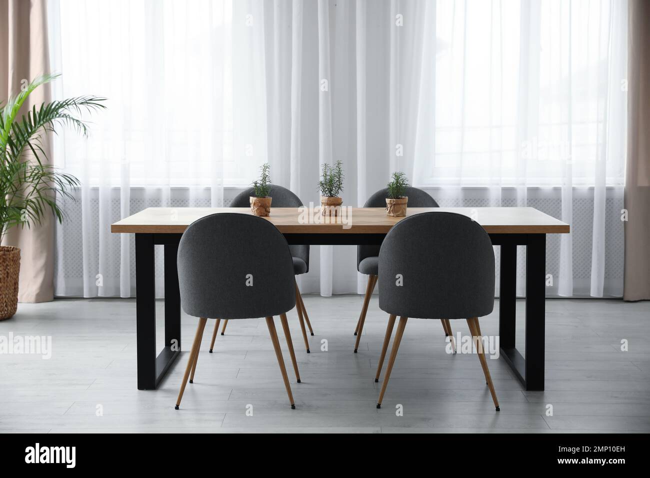 Modern room interior with chairs and table Stock Photo - Alamy