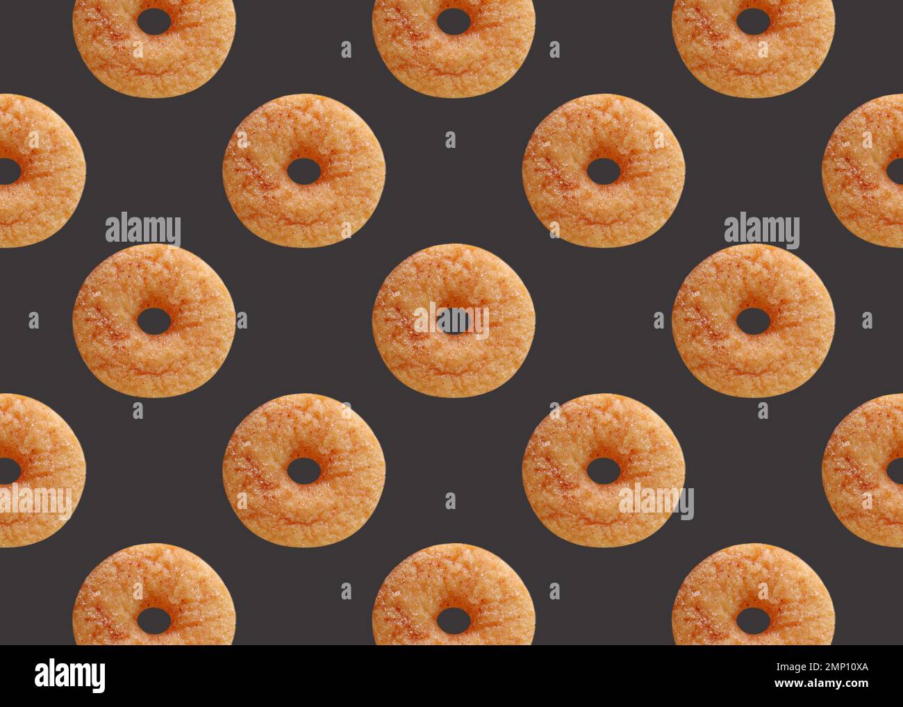 Delectable Pattern of Cinnamon Doughnut on Dark Gray Color Background ...