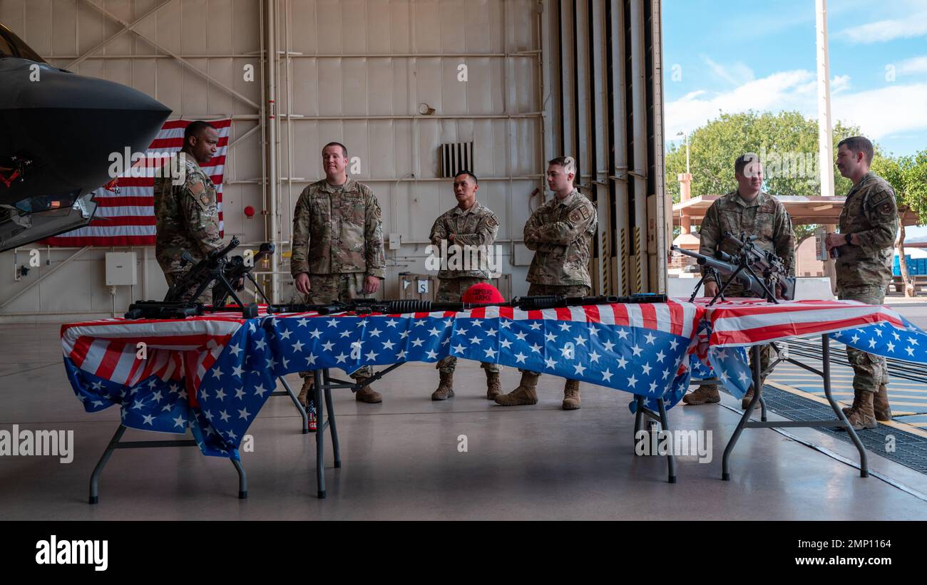 U.S. Air Force Airmen from the 56th Security Forces Squadron stand at the firearm display during ...