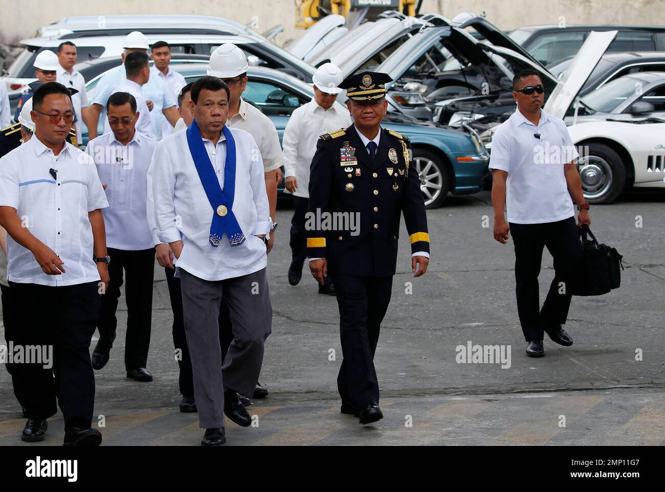 Philippine President Rodrigo Duterte, second from left in front, walks ...