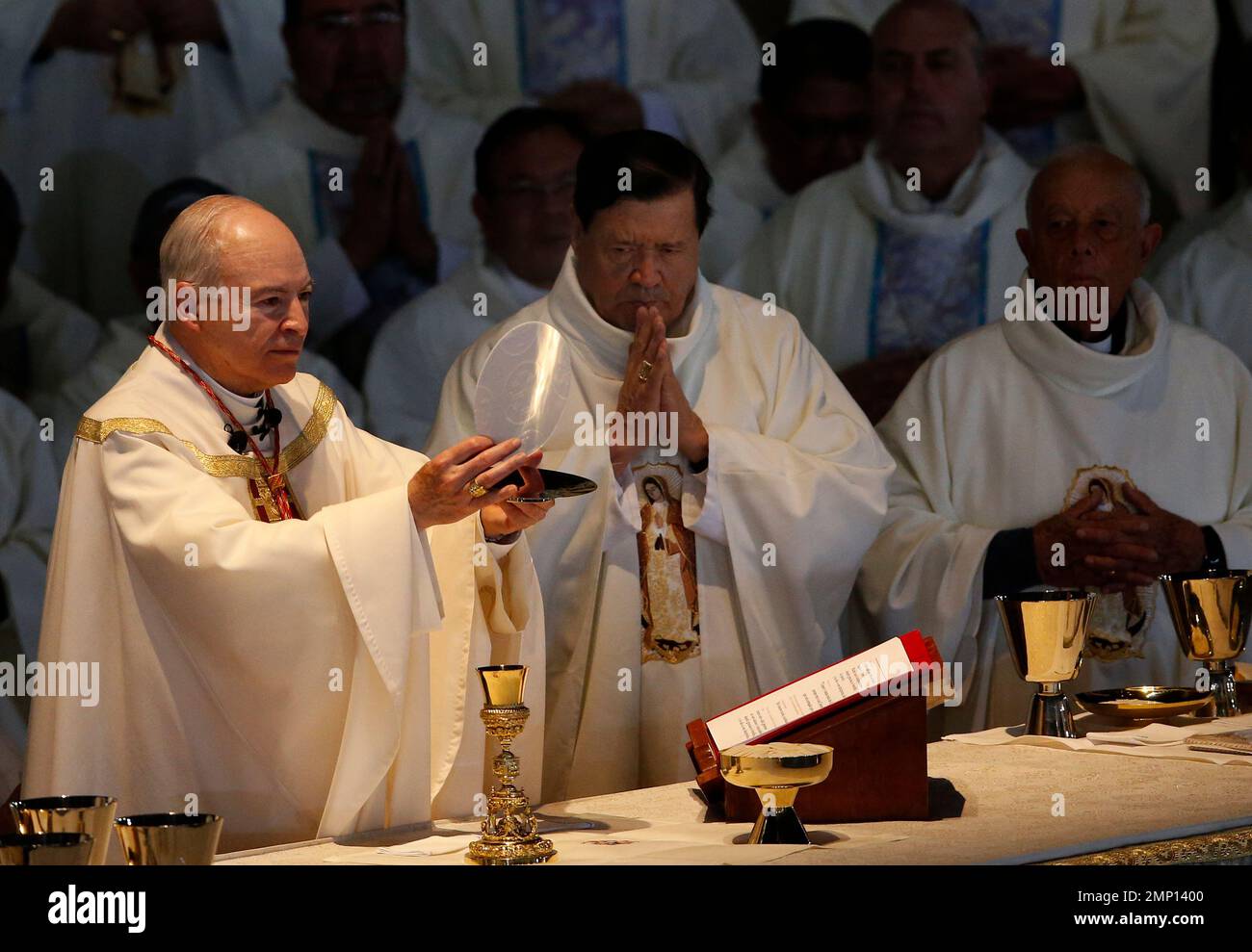 Mexico's new Archbishop Carlos Aguiar, left, and outgoing Archbishop ...