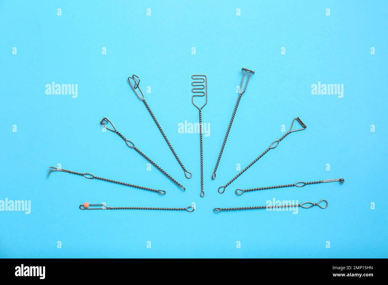 Set of logopedic probes for speech therapy on light blue background ...