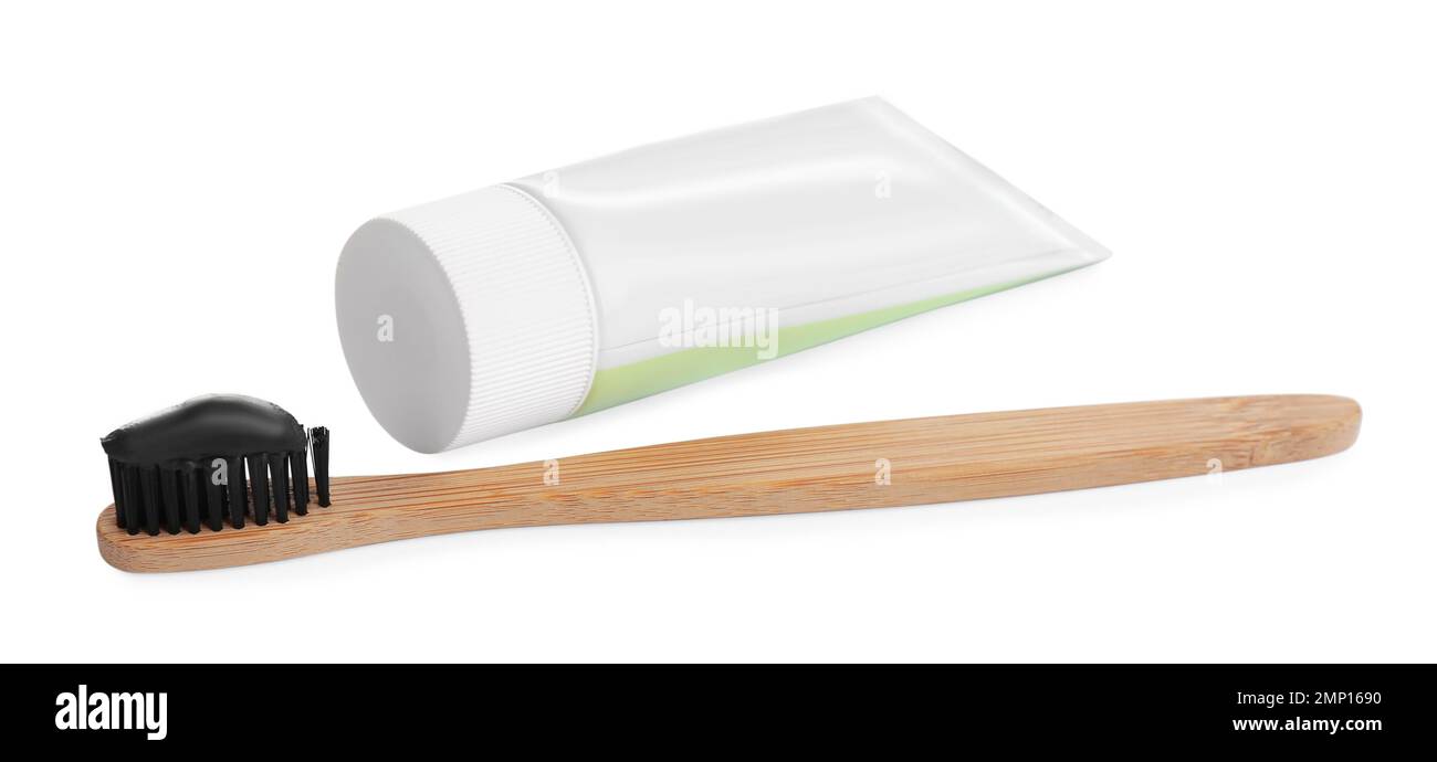 Bamboo toothbrush with charcoal paste isolated on white Stock Photo - Alamy