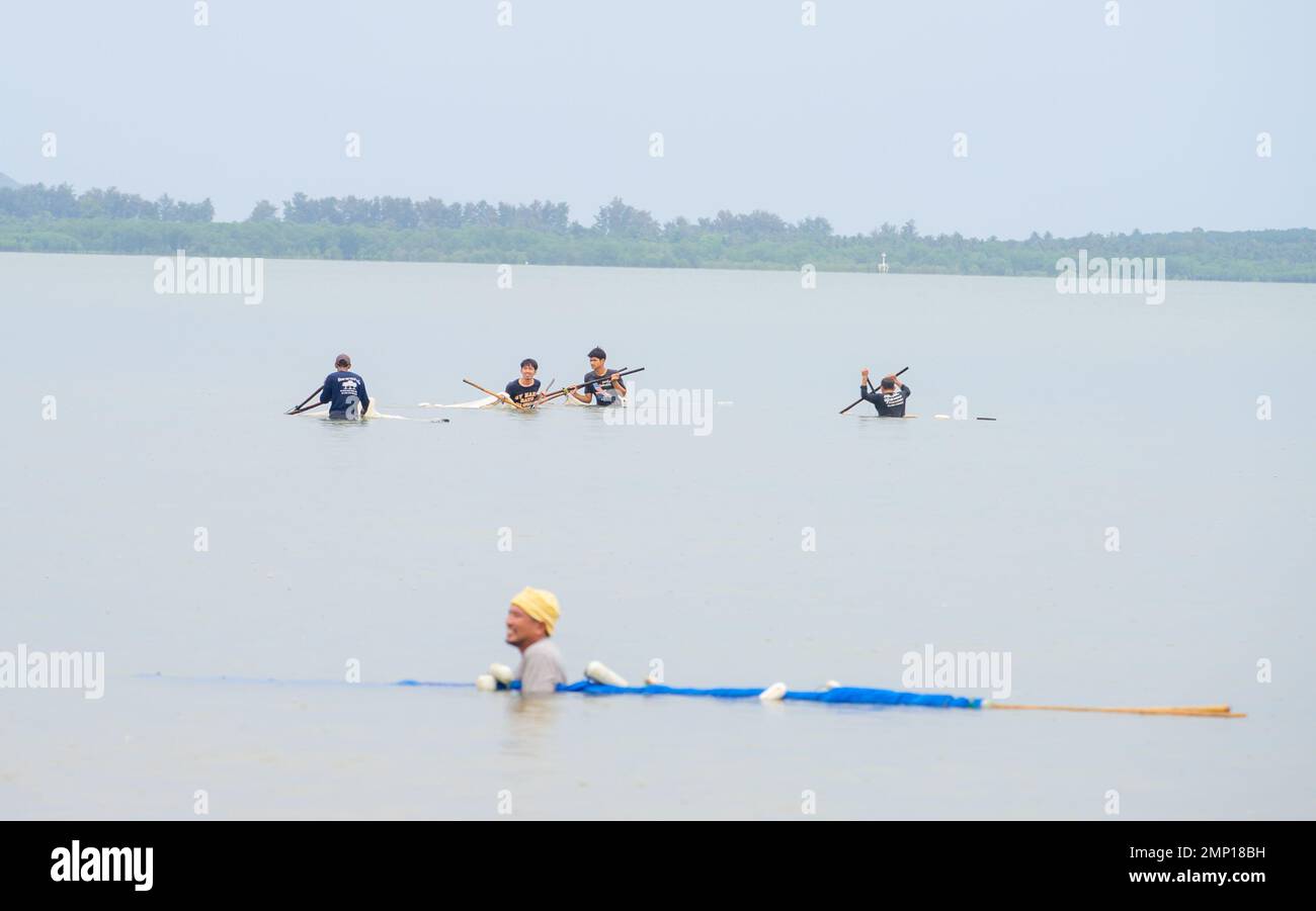 22 January 2023- Chumphon Thailand fishermen fish with nets in shallow ...