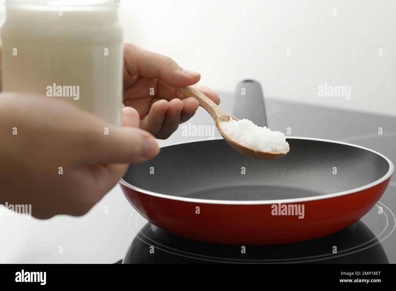 Woman coconut oil cook hi-res stock photography and images - Alamy