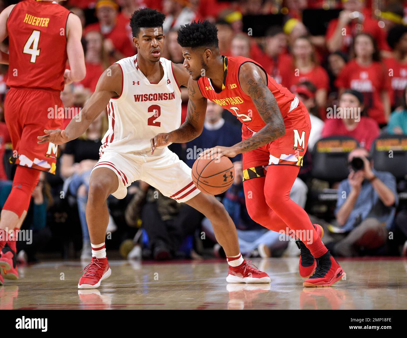 Maryland guard Dion Wiley (5) dribbles against Wisconsin forward Aleem ...