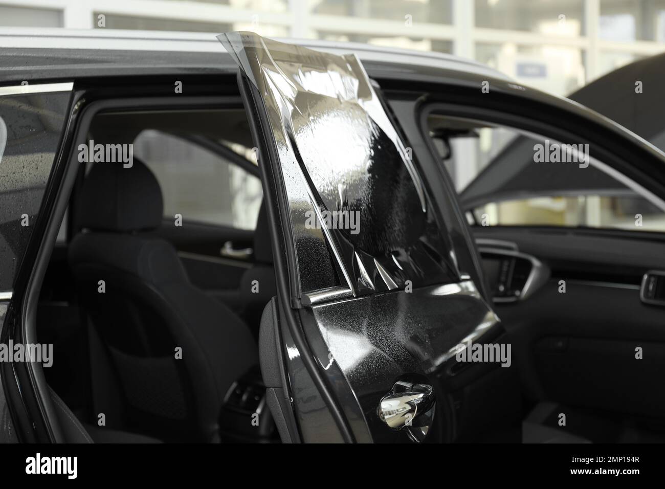 Car window covered with tinting foil, closeup Stock Photo - Alamy