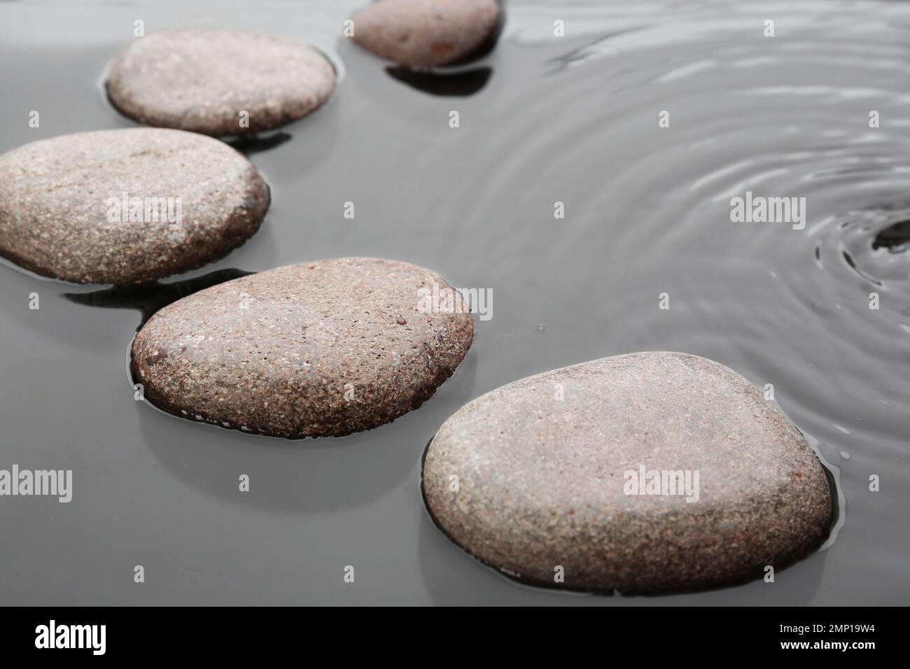 Beautiful spa stones in water. Zen lifestyle Stock Photo - Alamy