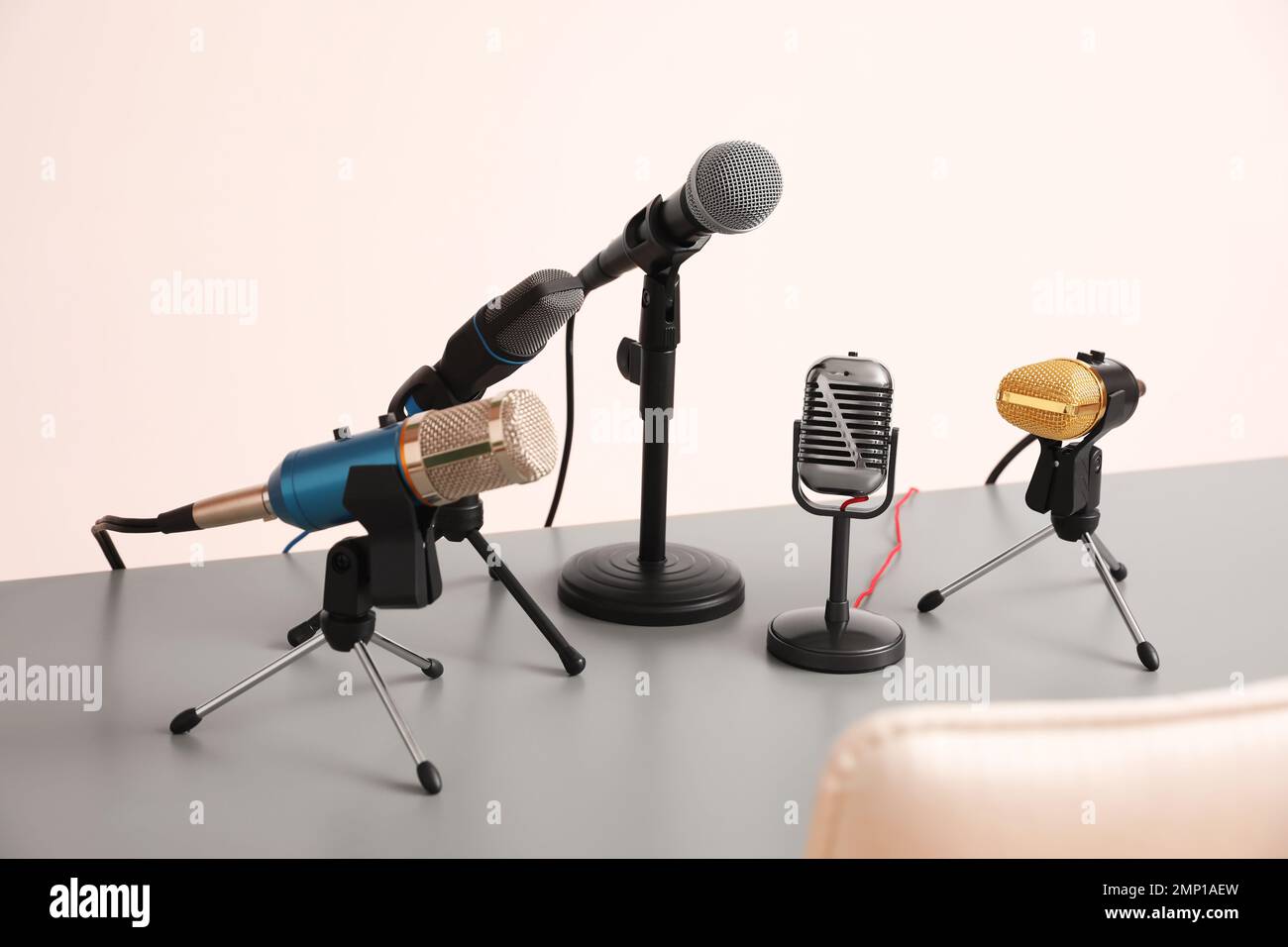 Microphones on light grey table in conference hall. Journalist's work ...