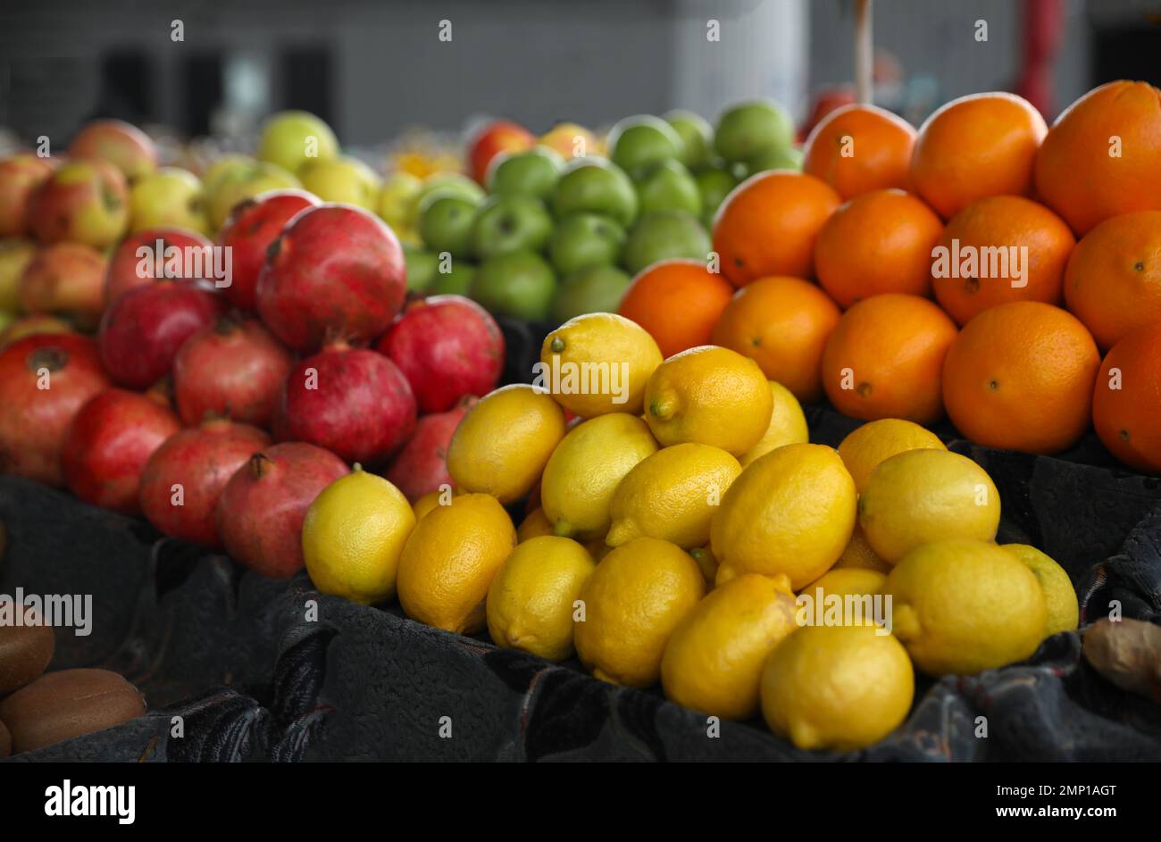 Tasty fresh fruits on counter at wholesale market Stock Photo - Alamy