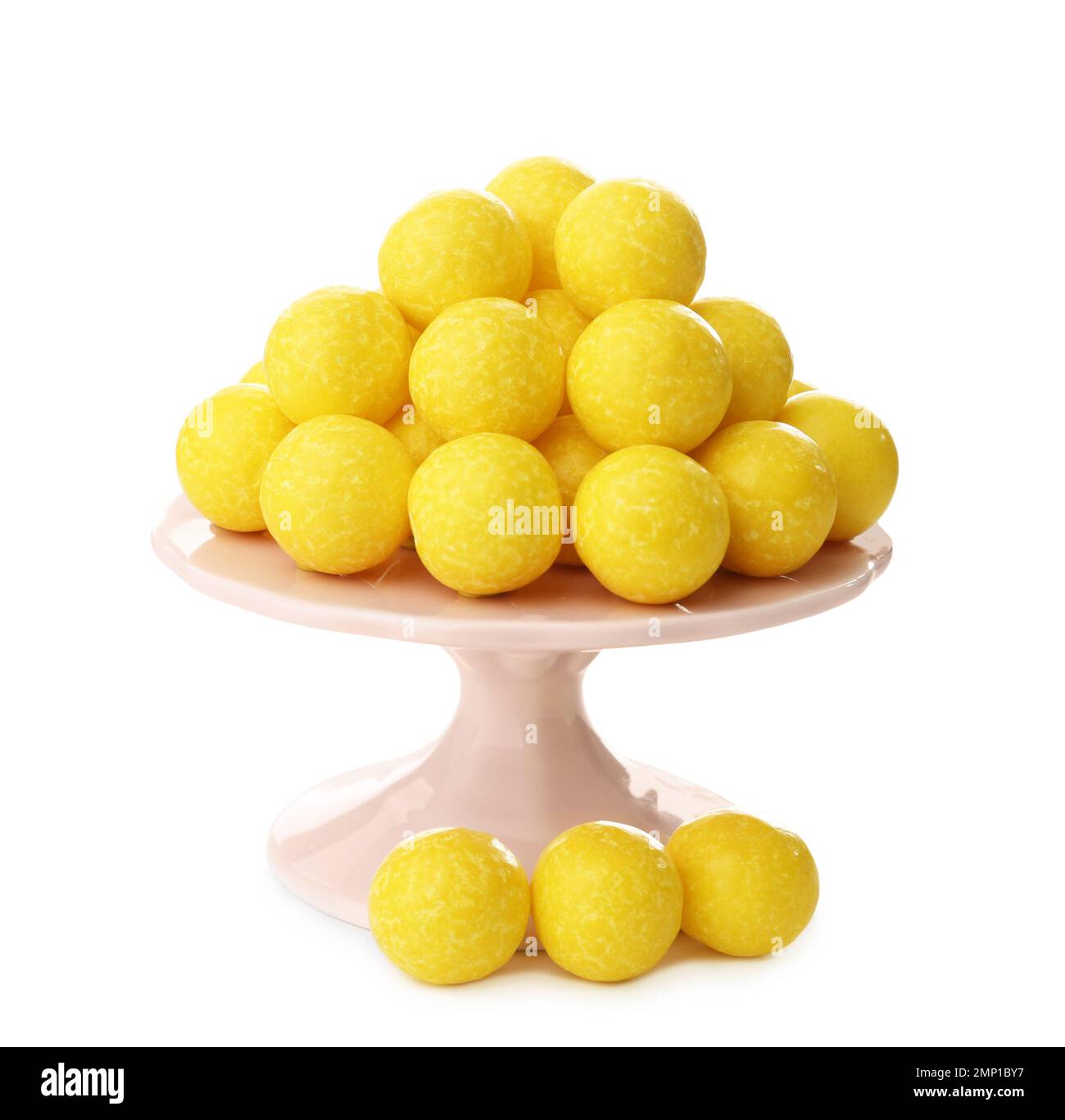 Tasty small lemon drops on white background Stock Photo - Alamy