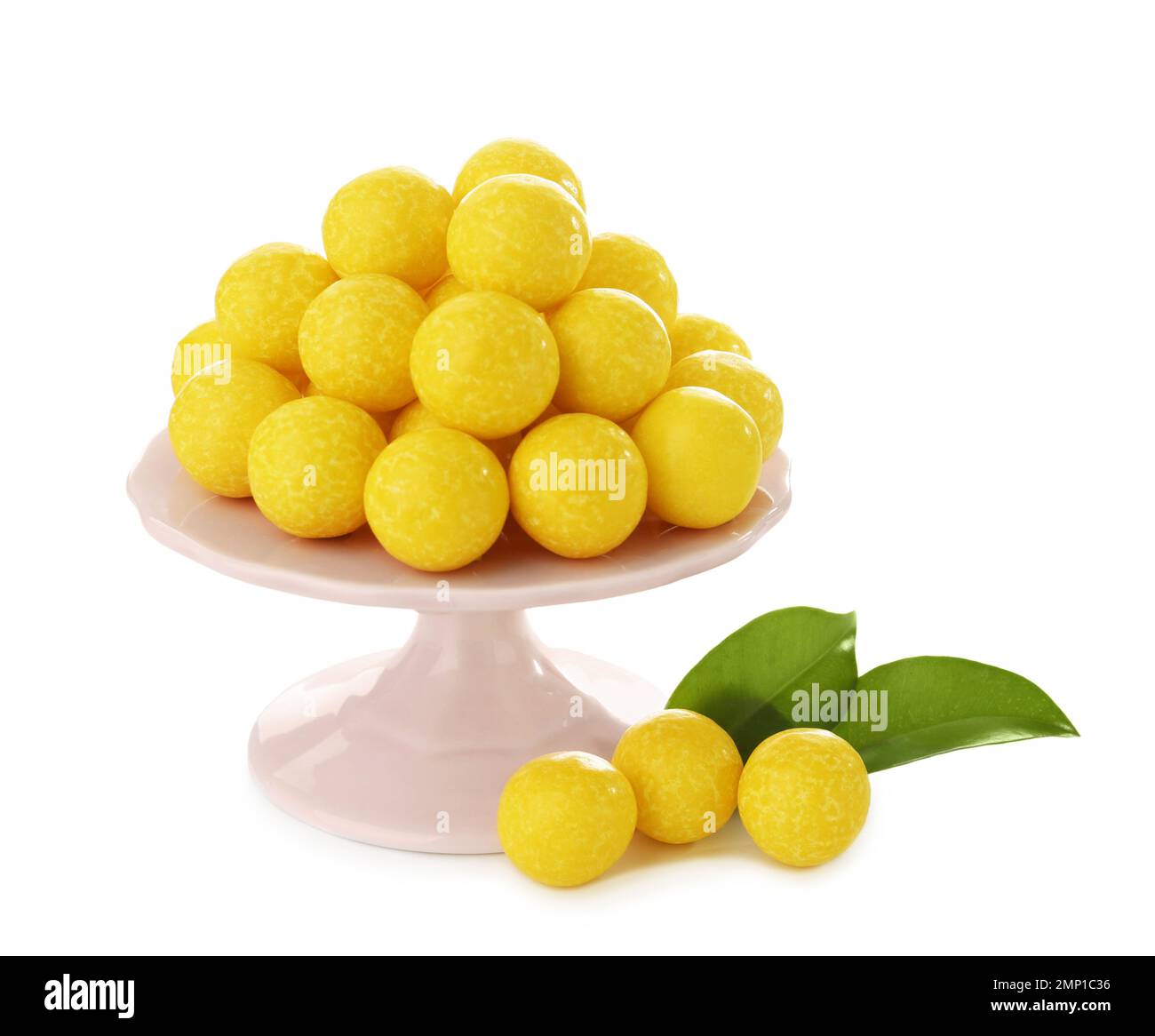 Tasty small lemon drops on white background Stock Photo - Alamy