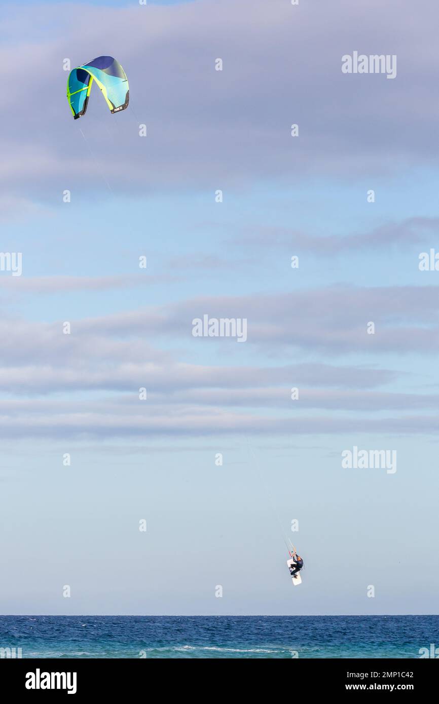 Experienced kitesurfer taking flight. Sotavento Beach, Fuerteventura ...